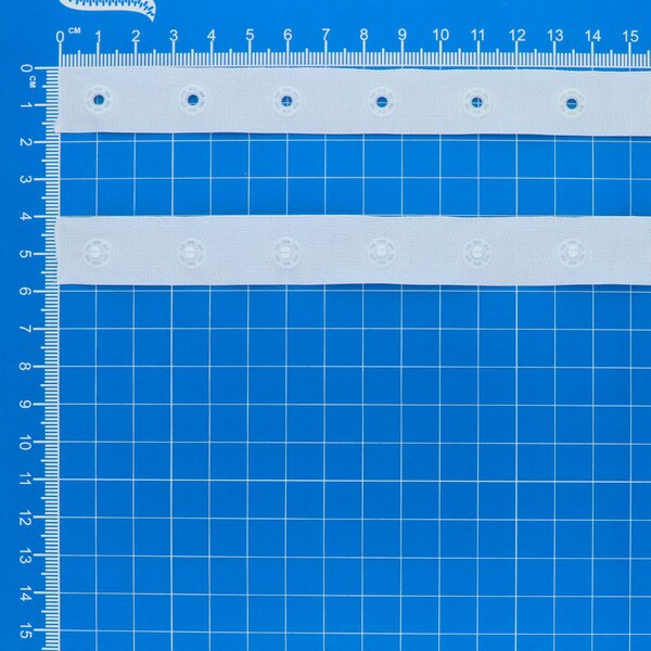 Cinta corchetera con broches de presión continuos blanca 18 mm